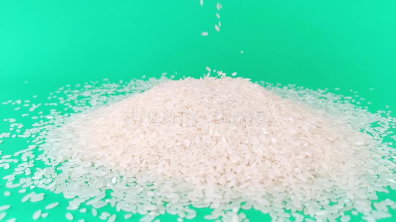 Rice Falls in a Pile on a Green Background Stock Video - Video of plant ...