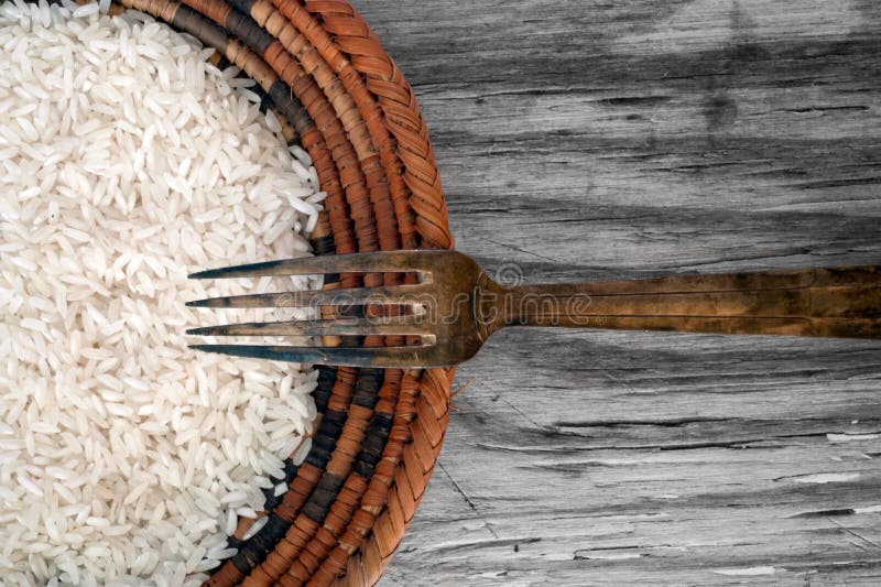 Rice and Fork Wood Background Stock Image - Image of uncooked, cereal ...