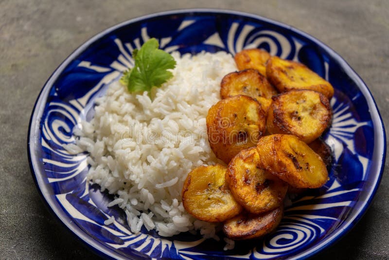 Rice and Fried Banana Also Called Cuban Style on Dark Background Stock ...