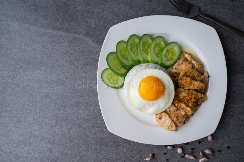 Rice,Fried Egg,Fried Chicken with Garlic and Black Pepper in White Dish ...