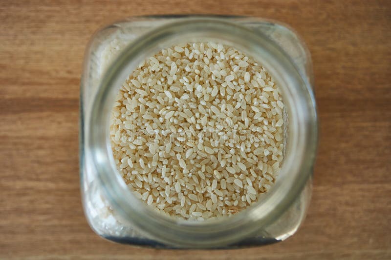 Rice in a Glass Jar with a Spoon, Closeup Stock Photo - Image of detail ...