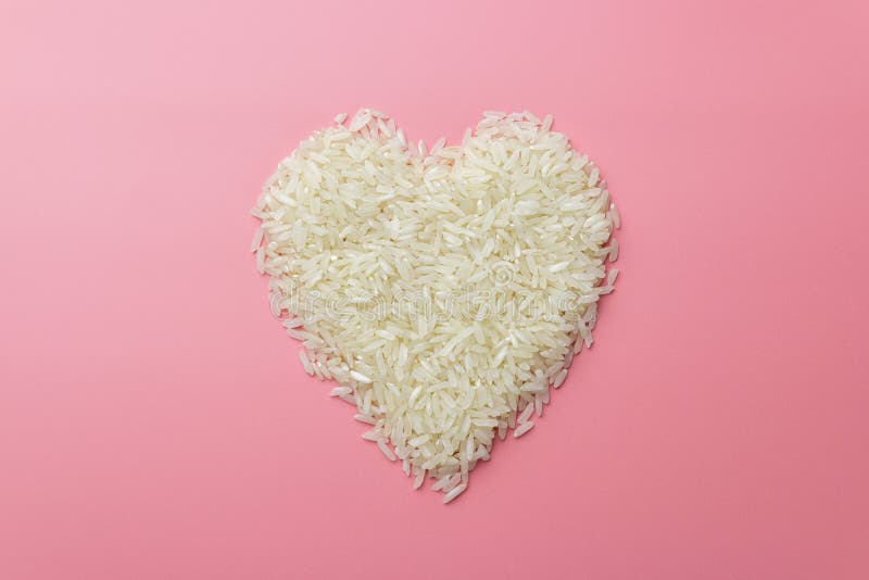 Rice Grains in Form of Heart on a Pink Background, Valentines Day Stock ...