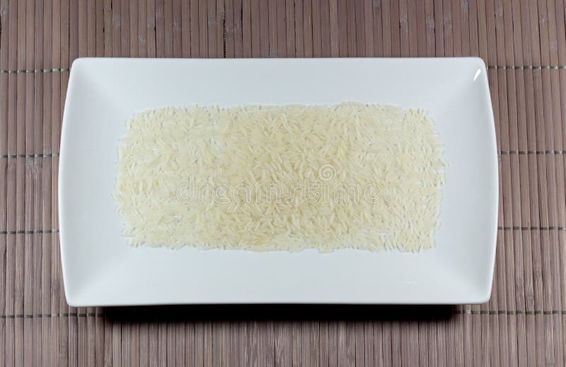 Rice Grains on a Rectangular Plate Stock Photo - Image of still, gray ...