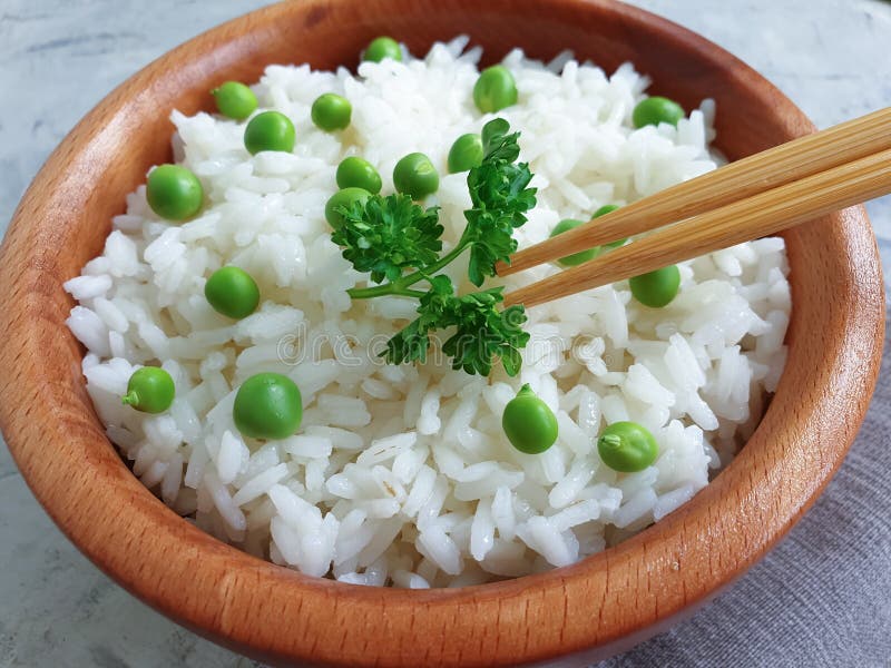 Rice with Green Peas, Sticks Eating Cooked on Concrete Background Stock ...