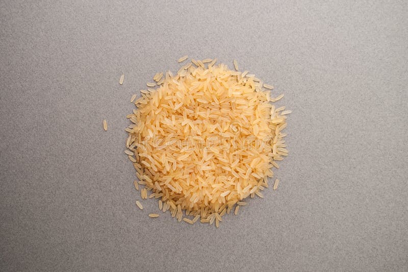 Rice Groats Lie All Around on a Light Gray Stone Table. Stock Photo ...