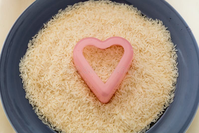 Rice in heart stock image. Image of uncooked, cooking - 65771757