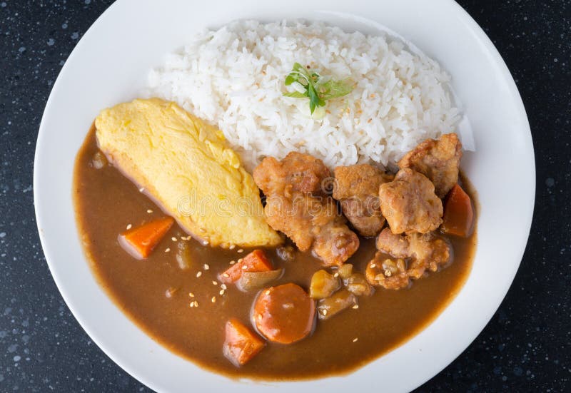 Rice with Japanese Curry with Omelette and Chicken Fried Stock Photo ...