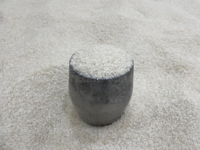 Rice Measuring Tool with a Pile of Rice in the Background Stock Photo ...