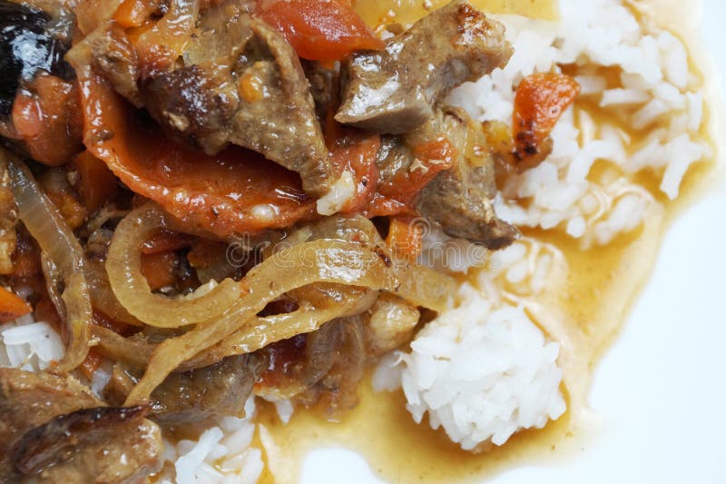 Rice and Meat Goulash with Vegetables on a White Plate Close-up Stock ...