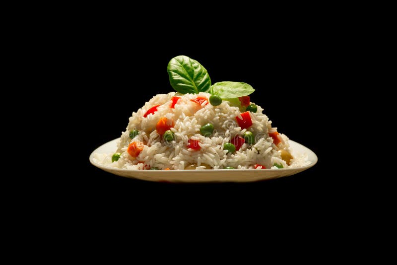 Rice with Meat and Vegetables in White Plate on Dark. Risotto Ri Stock ...