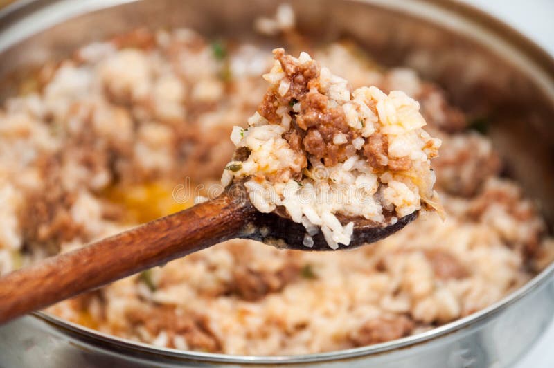 Rice with Minced Meat on the Wooden Scoop in Focus Stock Photo - Image ...