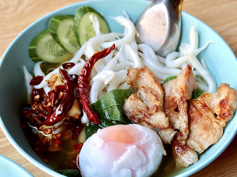 Rice Noodles in Fish Curry with Egg and Pork Stock Photo - Image of ...