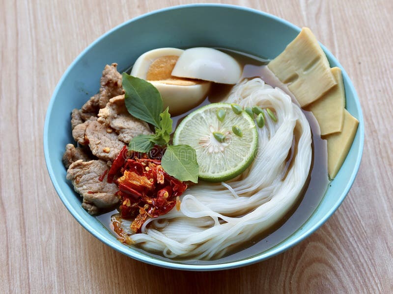 Rice Noodles in Fish Curry with Egg and Pork Stock Photo - Image of ...