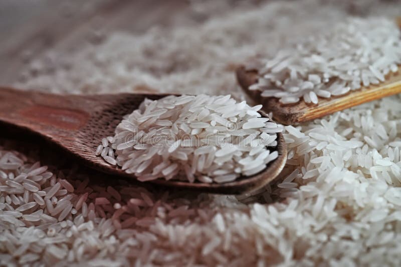 Rice on the Table Being Handled by a Wooden Spoon Stock Image - Image ...