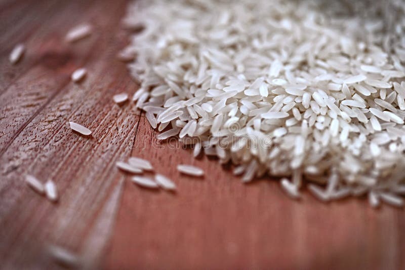 Rice on the Table Being Handled by a Wooden Spoon Stock Image - Image ...