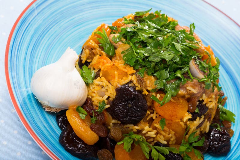 Rice Pilaf with Mutton, Prunes, Garlic Stock Photo - Image of raisins ...