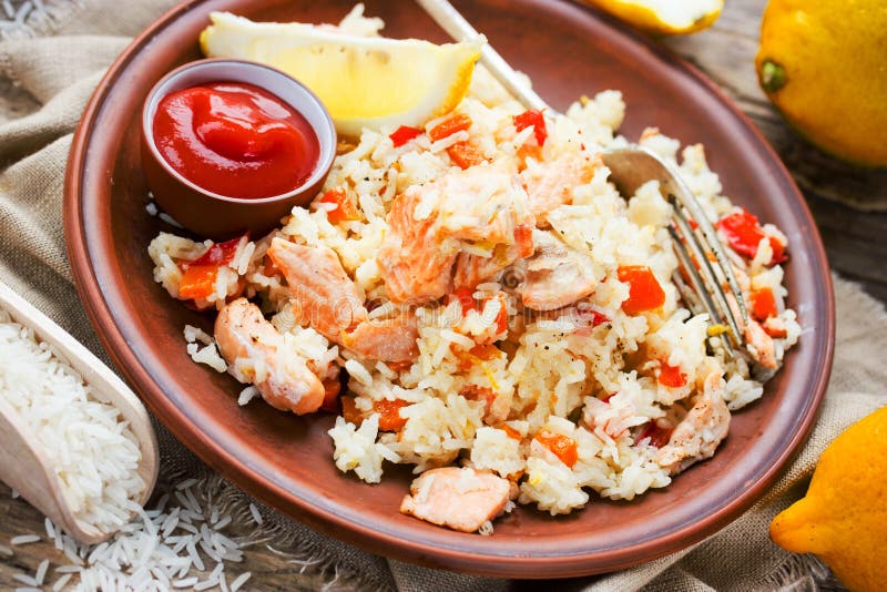 Rice Pilaf with Salmon, Lemon and Red Pepper Stock Image - Image of ...