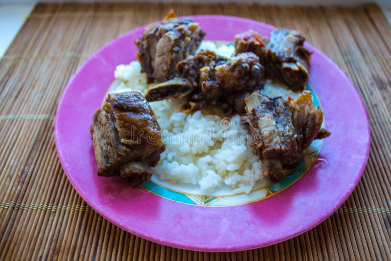 A Rice with Pork Ribs on a Plate Stock Image - Image of barbeque, dish ...