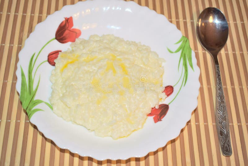 Rice Porridge on a Plate with Butter Stock Photo - Image of cuisine ...
