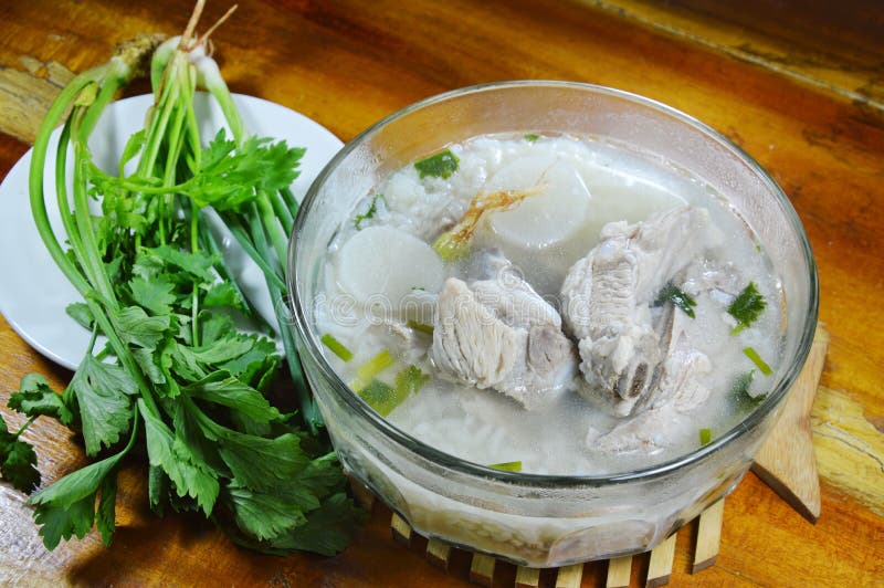 Rice Porridge with Pork Bone Hot Soup and Fresh Vegetable Stock Photo ...
