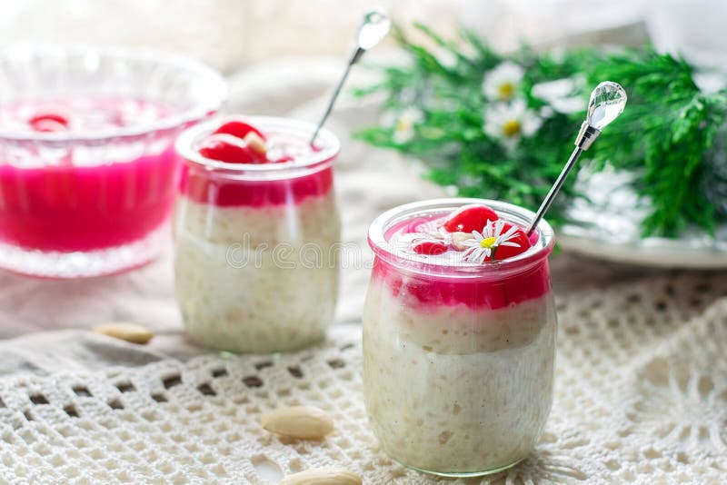 Rice Pudding with Almonds, Whipped Cream and Cherry Sauce Stock Image ...