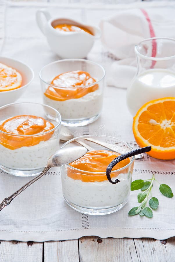 Rice Pudding with Orange Custard Stock Photo - Image of lunch ...