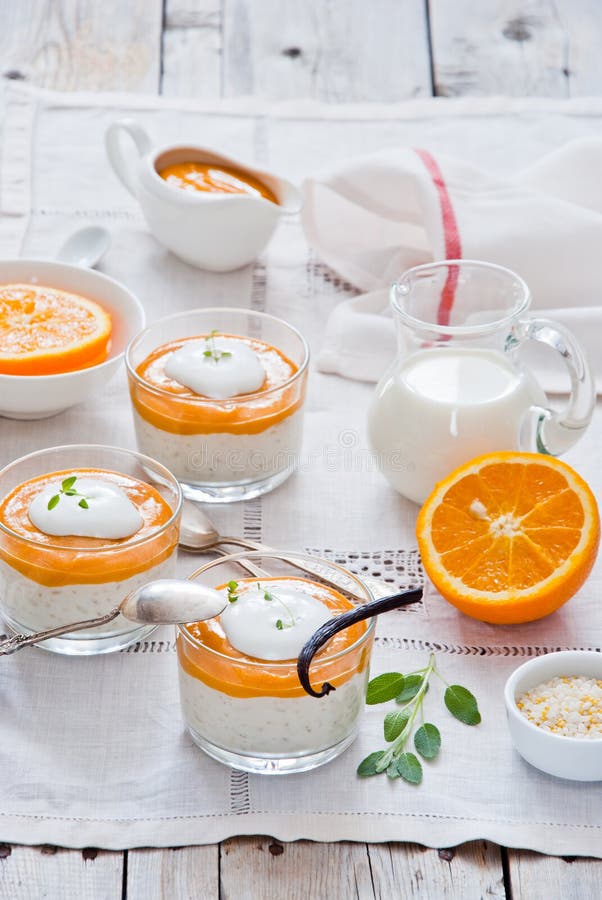 Rice Pudding with Orange Custard Stock Photo - Image of cream, glass ...