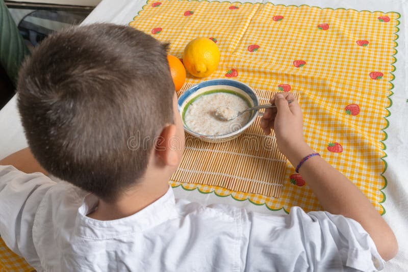 Rice Pudding on the Spoon a Child is Holding As he Eats it. Stock Photo ...