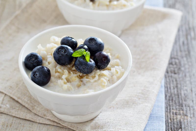 Rice Pudding with Syrup and Berries Stock Photo - Image of closeup ...