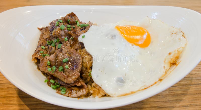Rice with Roast Beef Barbecue Sauce and Fried Egg Stock Photo - Image ...