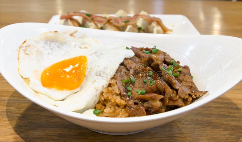 Rice with Roast Beef Barbecue Sauce and Fried Egg Stock Photo - Image ...