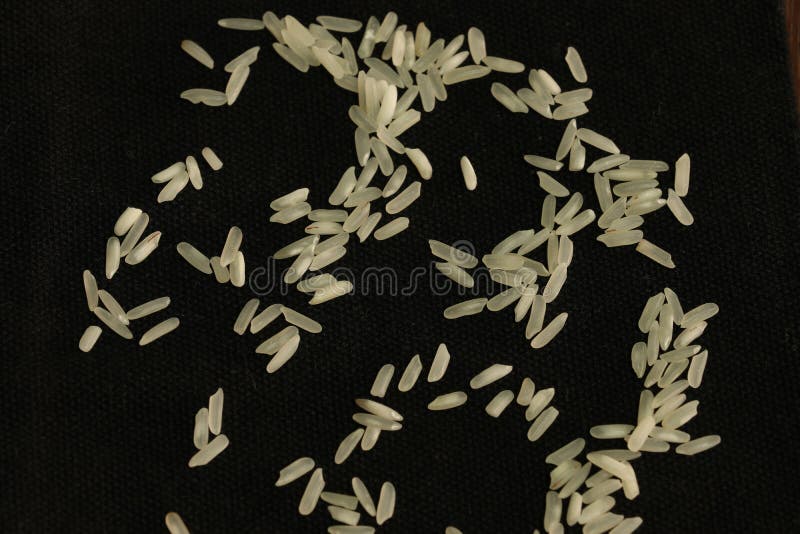 Rice Scatter on Black Background Stock Photo - Image of main, meal ...