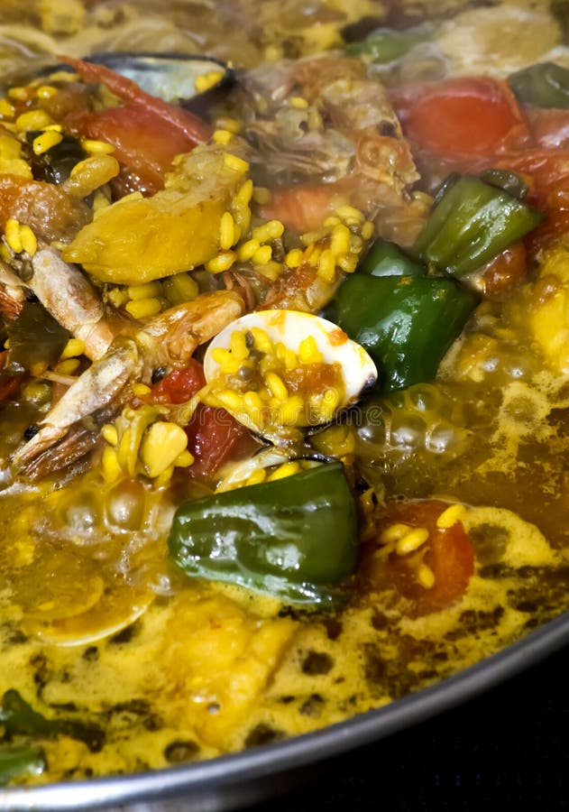 Rice with seafood cooking stock photo. Image of paella - 56615720