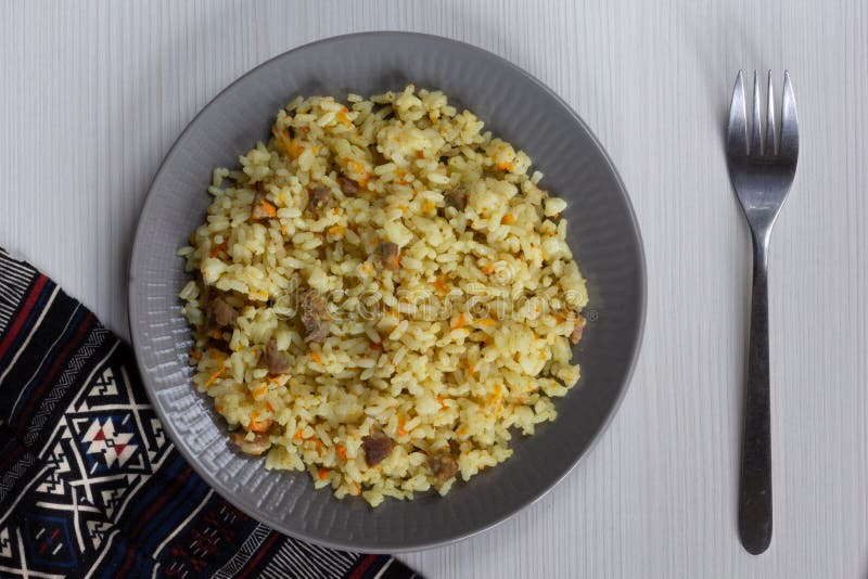 Rice with Small Pieces of Meat and Carrot Grey Plate Stock Image ...
