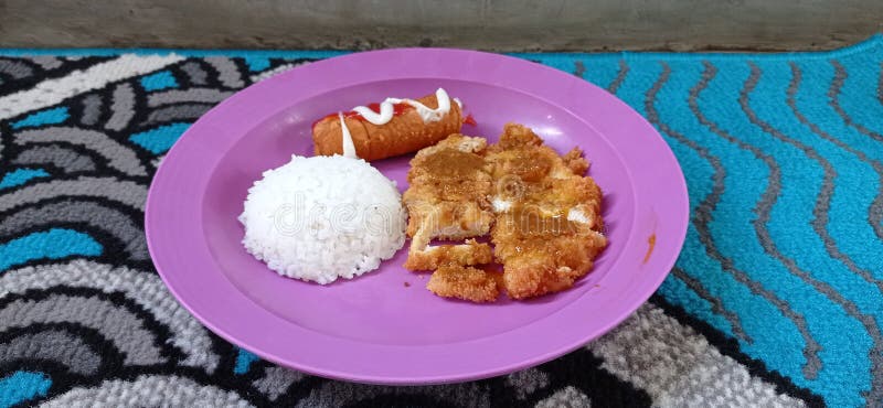 Rice with Sosis and Chicken Nugget in the Plastic Plate Stock Image ...