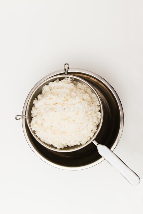 Rice in strainer stock photo. Image of background, dinner - 242852140