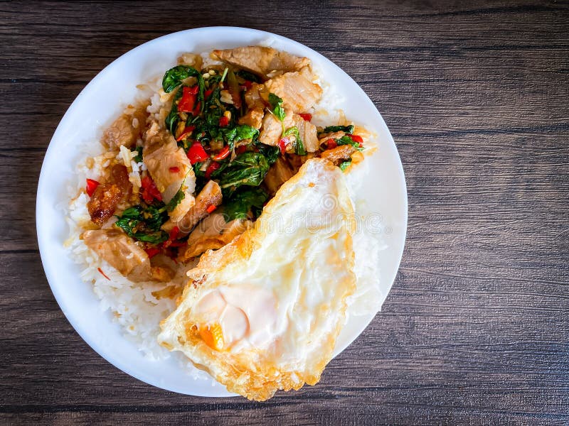 Rice Topped with Crispy Pork Belly with Thai Basil Stock Image - Image ...