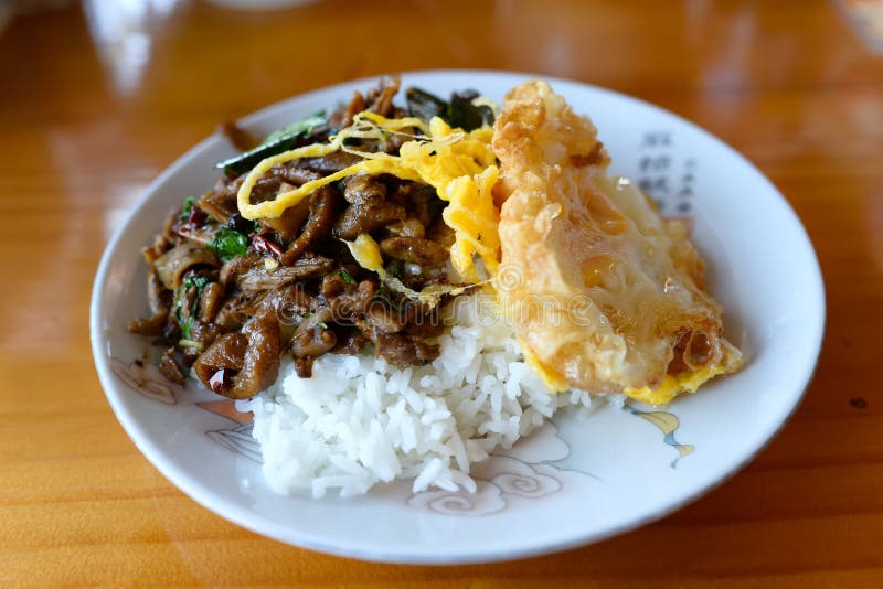 Rice Topped with Stir-fried Basil Duck and Fried Egg. Stock Image ...