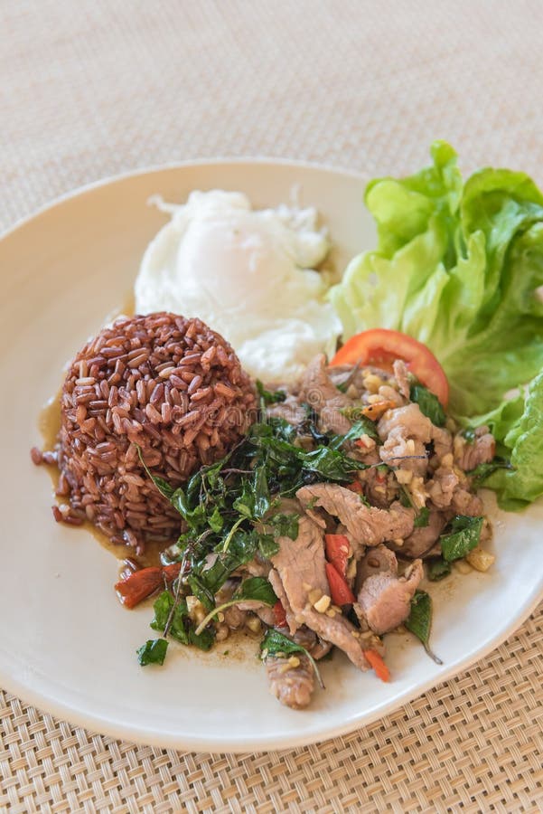Rice Topped with Stir-fried Beef and Basil with Fried Egg Stock Image ...