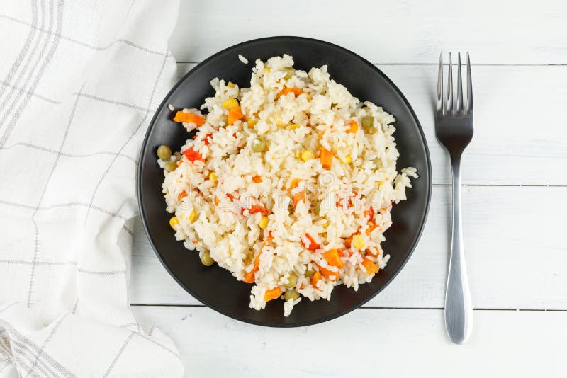 Rice with Vegetables in a Plate on the Table Stock Image - Image of ...