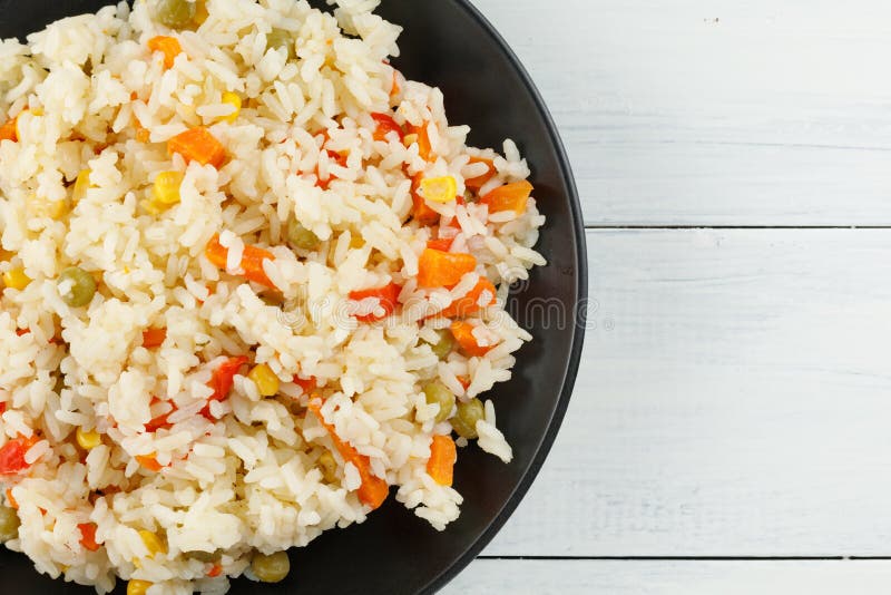 Rice with Vegetables in a Plate on the Table. Place for Text Cope Stock ...