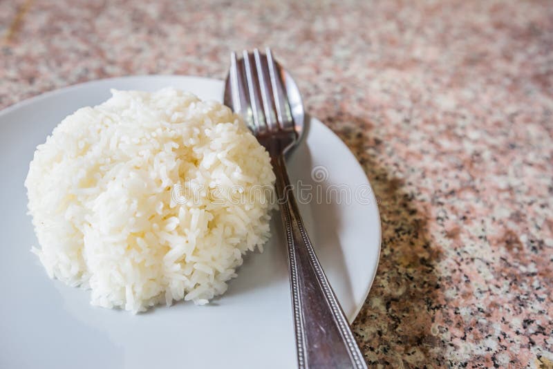 Rice in White Dish with Silverware on the Marble Table Stock Image ...