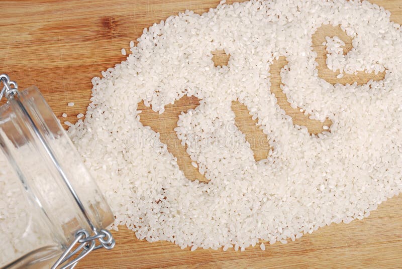 Rice on a wooden board stock photo. Image of natural - 69793376