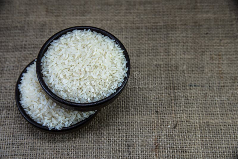 Rice in wooden bow stock image. Image of grain, traditional - 101219749