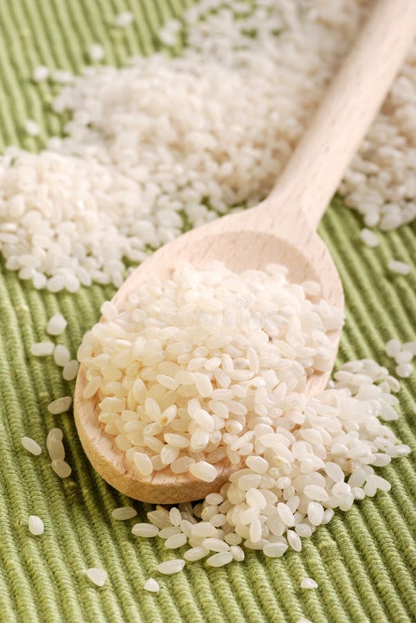 Rice in wooden spoon stock image. Image of kitchen, crop - 28037013