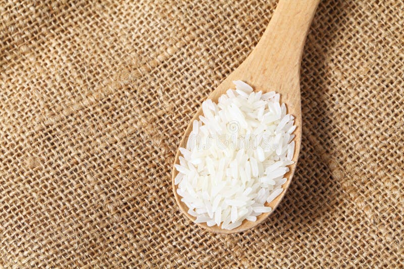 Rice with wooden spoon stock image. Image of asian, ethnicity - 29784575
