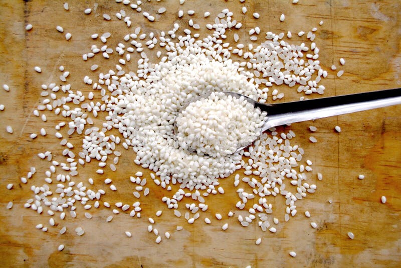 An African Woman Spreads Rice To Dry. Editorial Stock Image - Image of ...