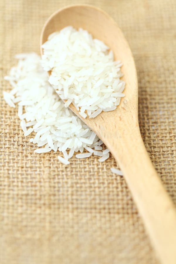 Rice with wooden spoon stock image. Image of fiber, rice - 29784573