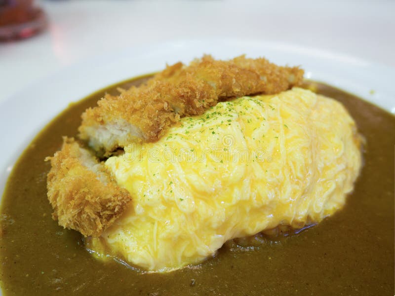 Rice Wrapped Eggs with Fried Pork Tonkatsu Curry Stock Image - Image of ...