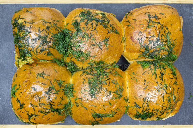 Rich, Fluffy Fresh Buns with Garlic and Dill on a Black Kitchen Board ...